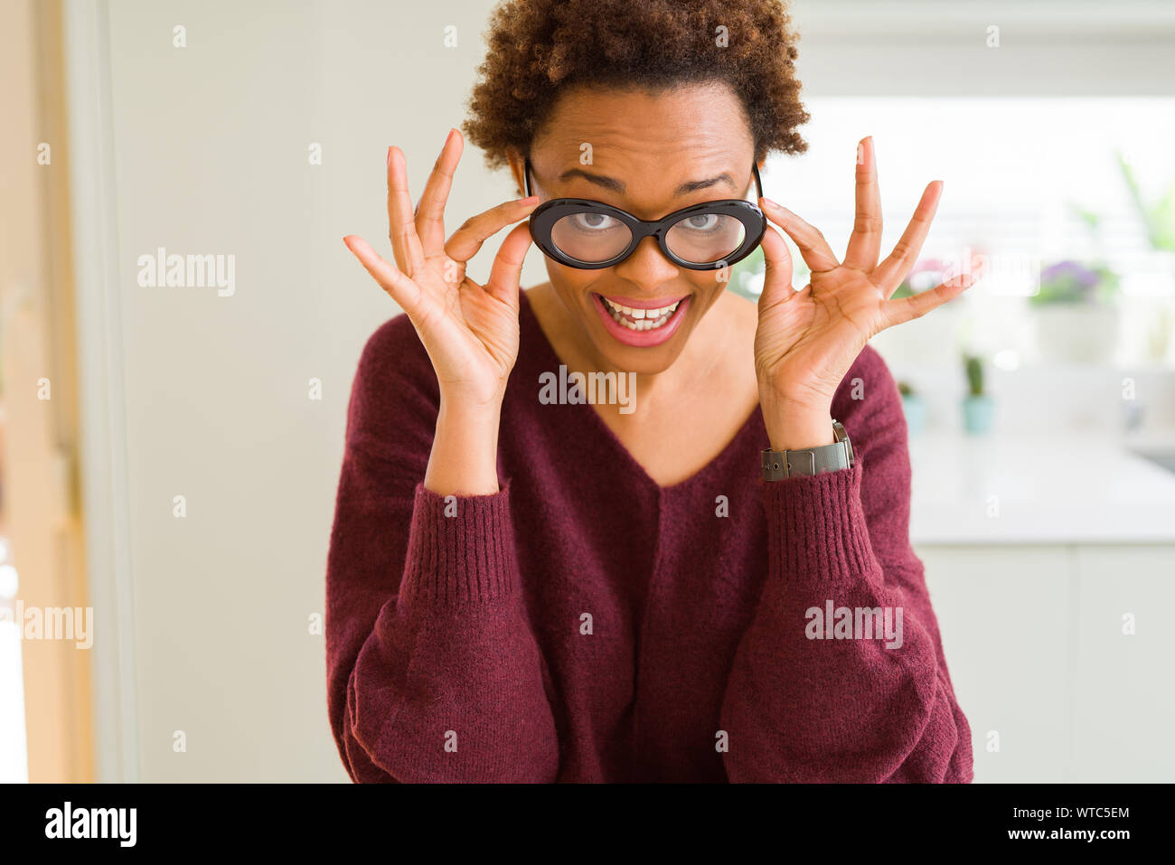 Beautiful young african woman with afro hair wearing glasses Stock ...