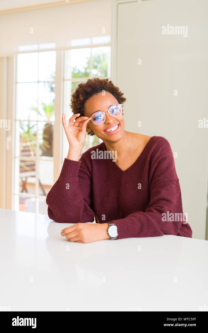 Beautiful young african woman with afro hair wearing glasses Stock ...