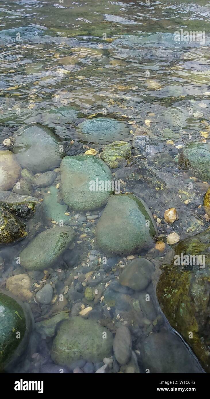Rocks in shallow water hi-res stock photography and images - Alamy