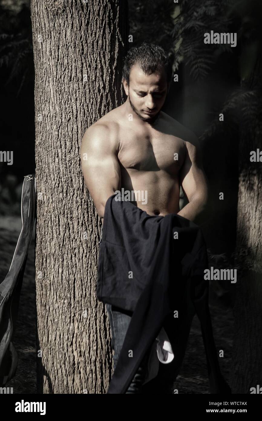 Man removing shirt hi-res stock photography and images - Alamy