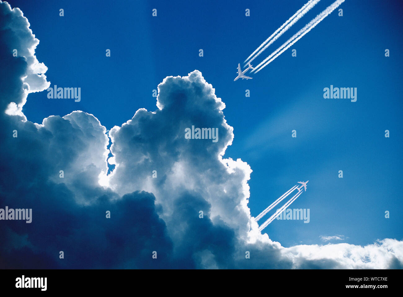 Two Jet Airplanes Passing Each other in the Sky Stock Photo - Alamy