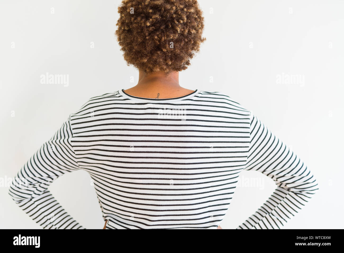 Young beautiful african american woman wearing stripes sweater over ...