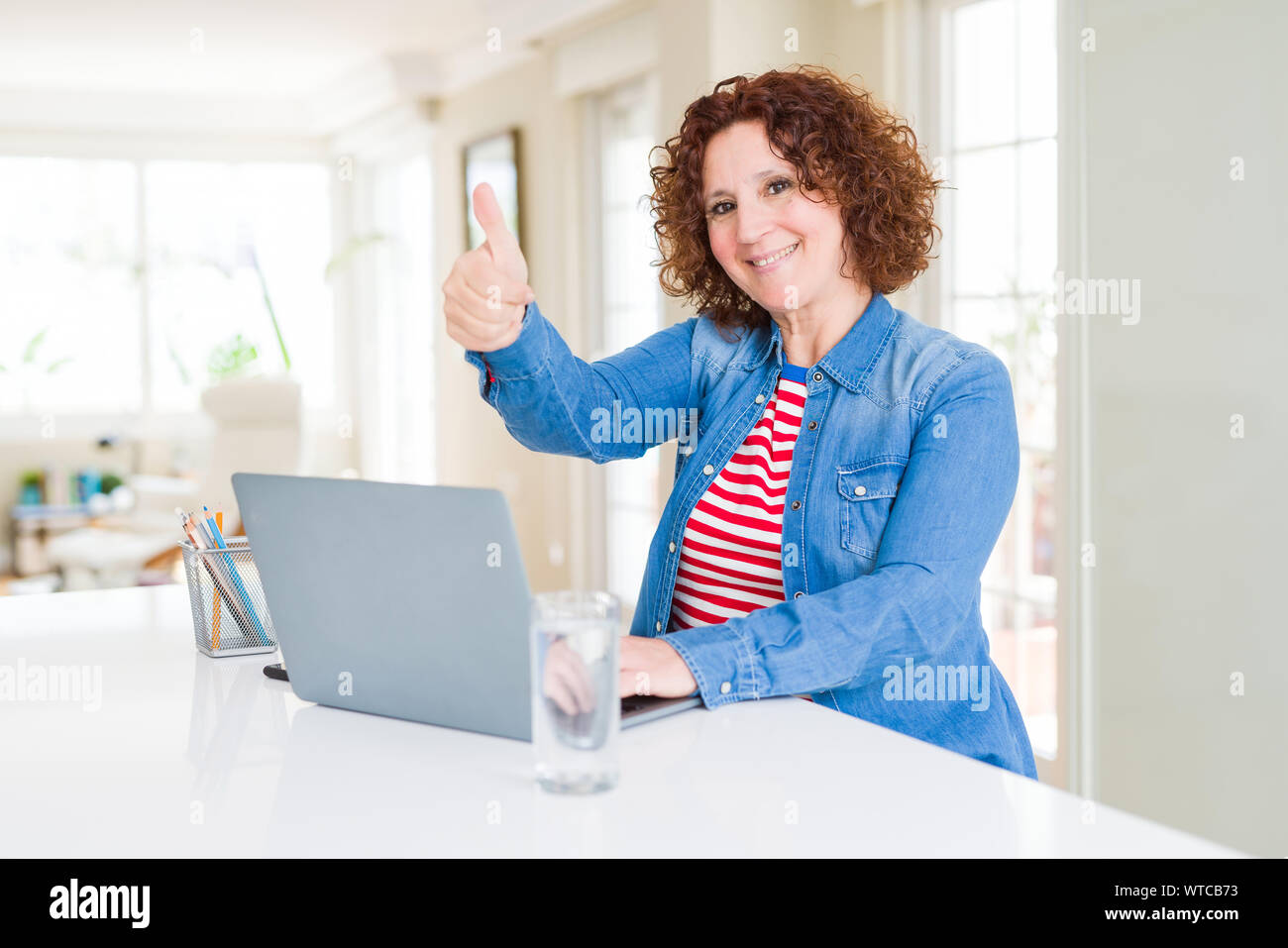 Senior woman working using computer laptop happy with big smile doing ...