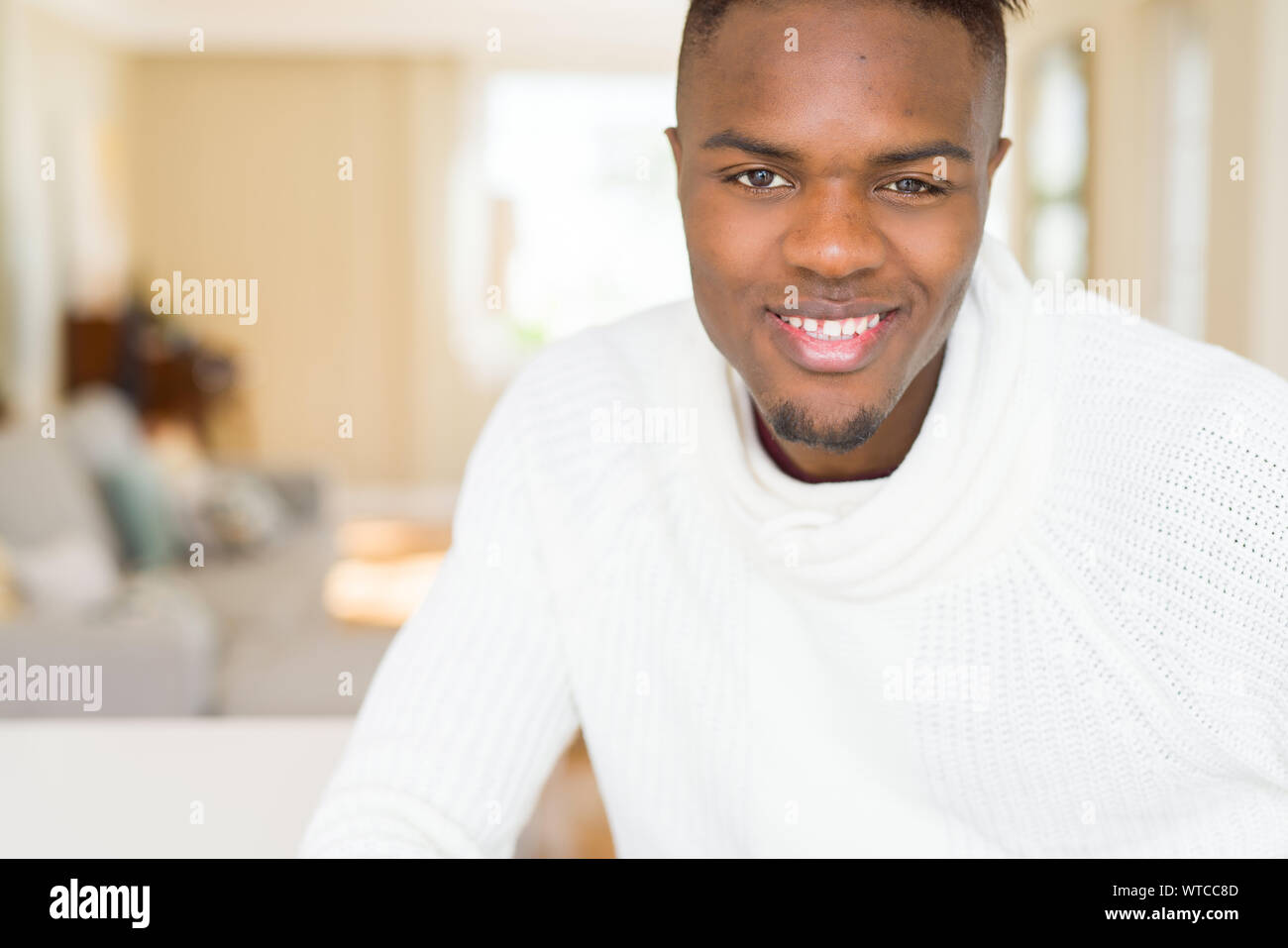Handsome african young man smiling cheerful with a big smile on face ...