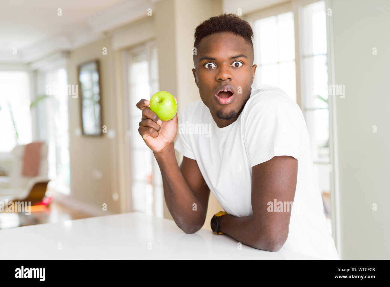 Portrait man apple in mouth hi-res stock photography and images - Alamy