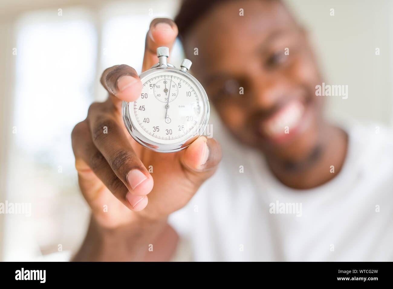 Man running stopwatch handsome hi-res stock photography and images - Alamy