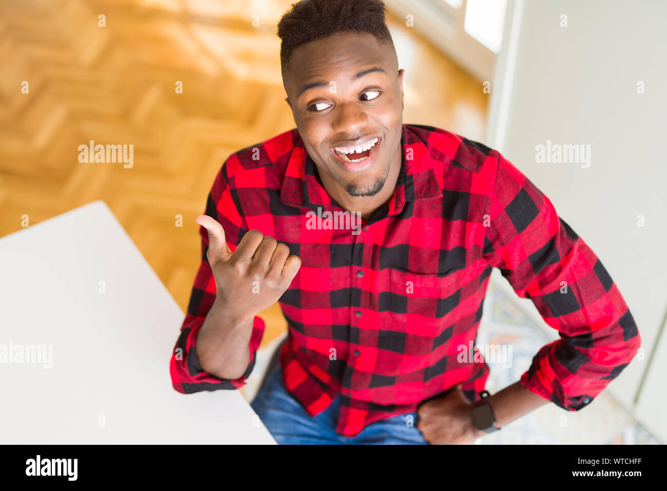 Overhead angle of handsome african american man smiling with happy face ...