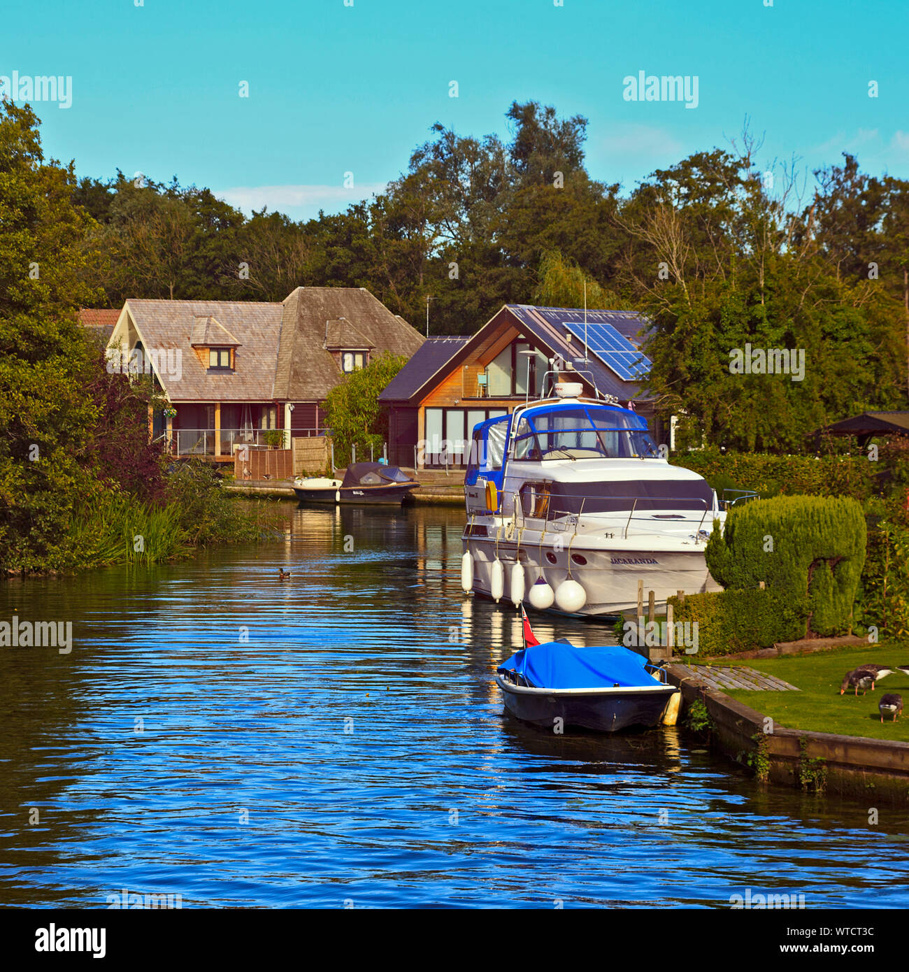 Lodges with boat moorings up a Small Creek off the River Bure on the ...