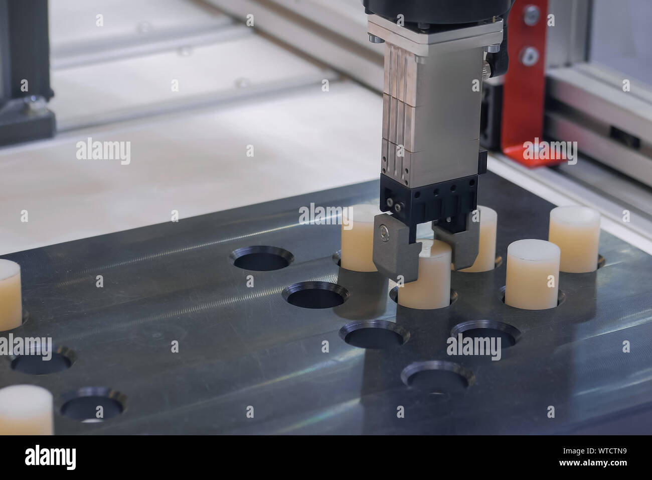 Automated robotic clamp arm, robot hand during work at exhibition ...