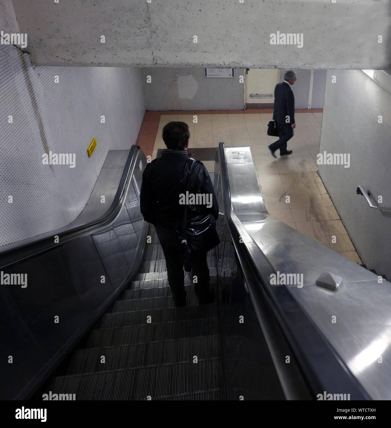 Two people walking down steps hi-res stock photography and images - Alamy