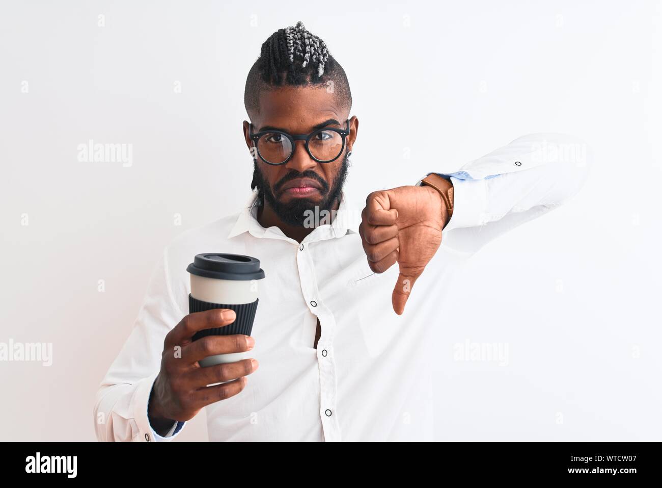 African american businessman with braids drinking coffee over isolated ...