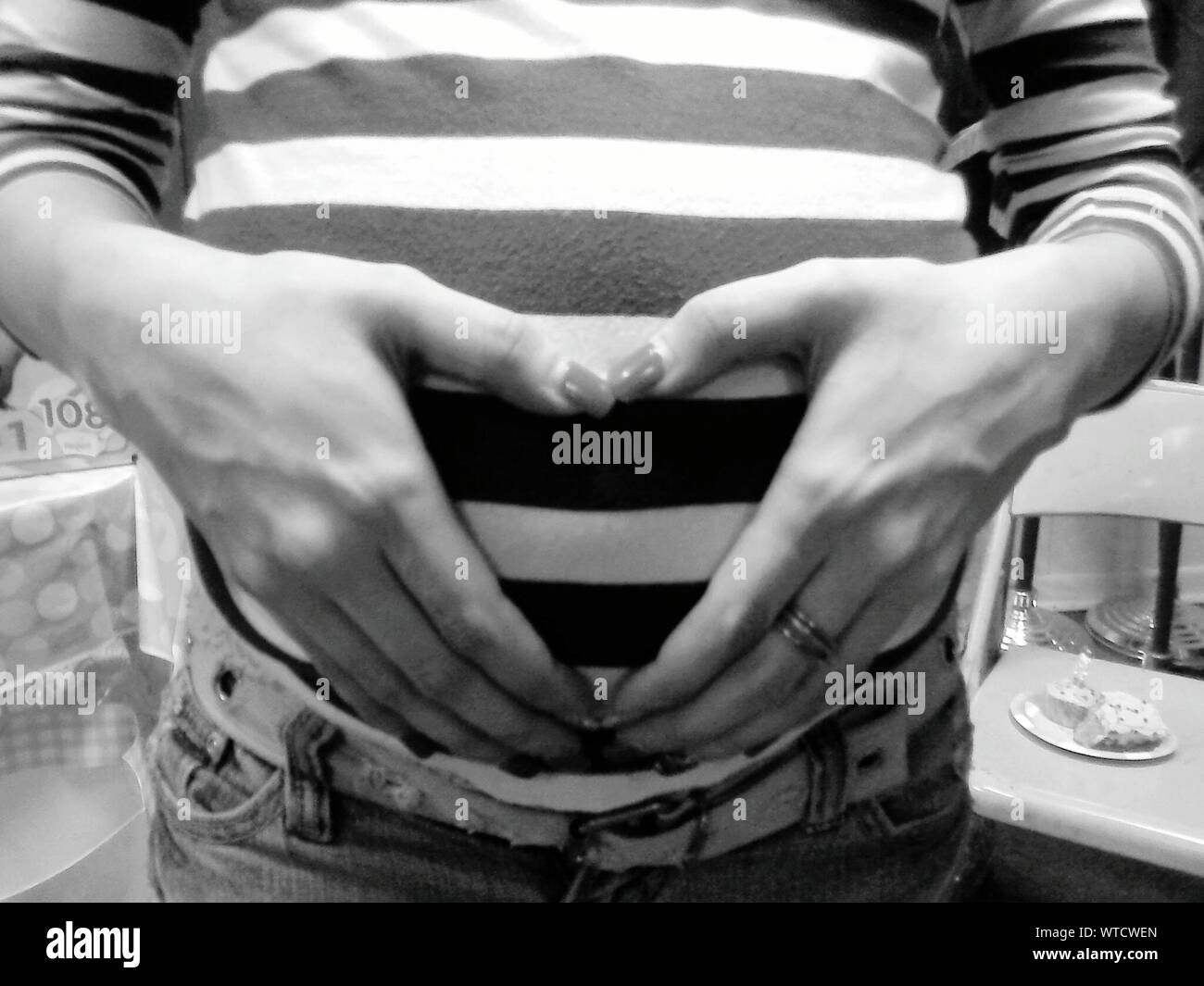 Women touching belly High Resolution Stock Photography and Images - Alamy