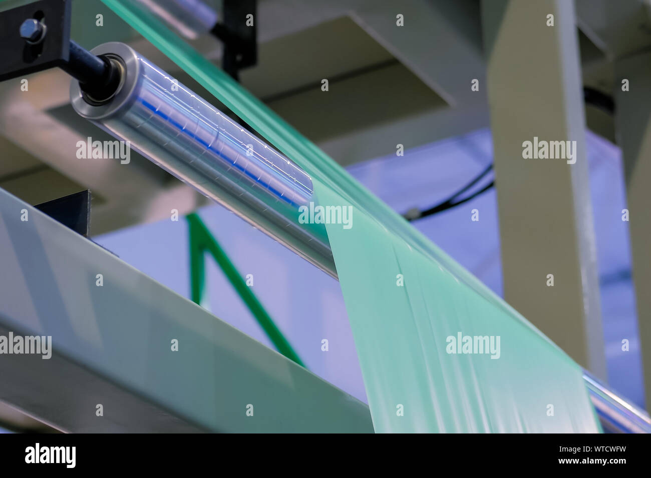 Automatic plastic bag making machine - roller with green polyethylene ...