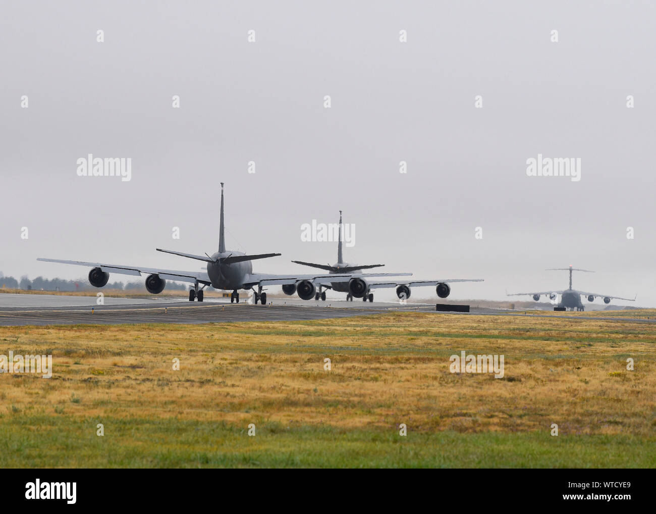 Two U.S. Air Force KC-135 Stratotankers taxi down the flightline during ...