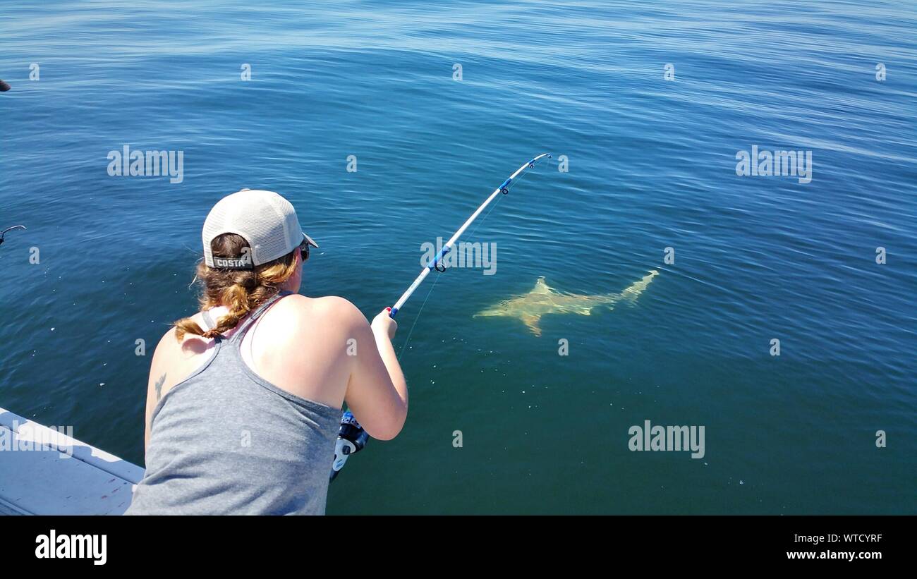 Woman fishing sea hi-res stock photography and images - Alamy