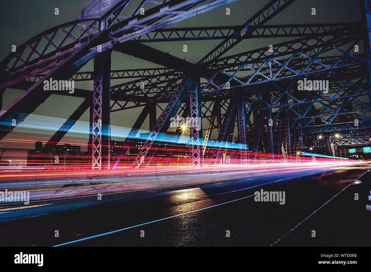 Light Trails On Street At Bridge At Night Stock Photo - Alamy