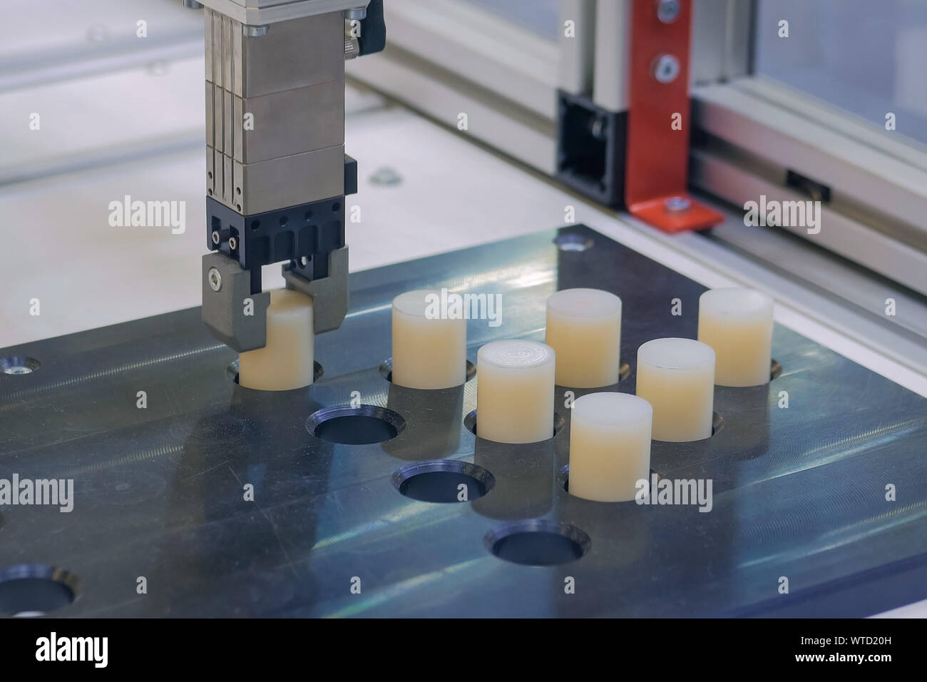 Automated robotic clamp arm moves and places objects at trade show ...