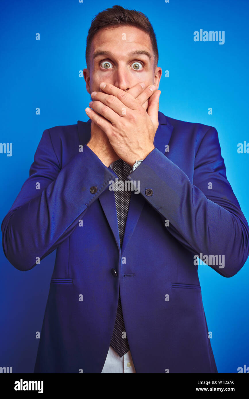 Vertical angle picture of young handsome business man over blue ...