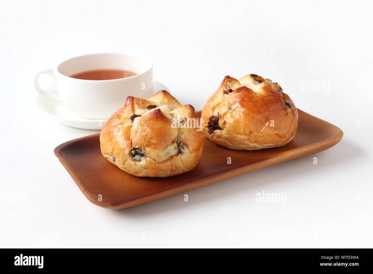 raisin bread with English tea closeup isolated on white background ...