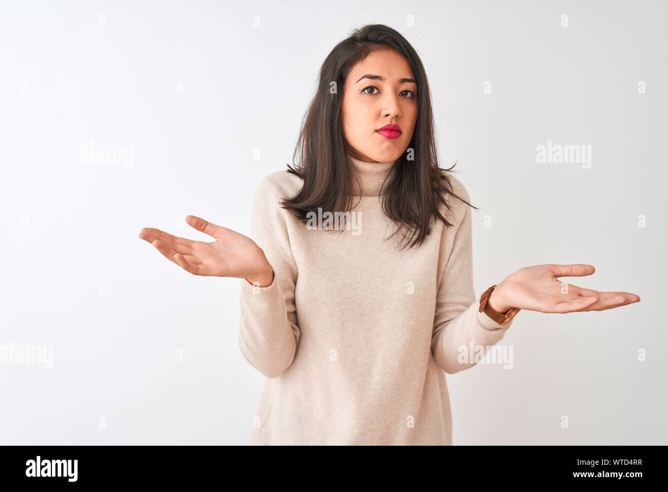 Beautiful chinese woman wearing turtleneck sweater standing over ...