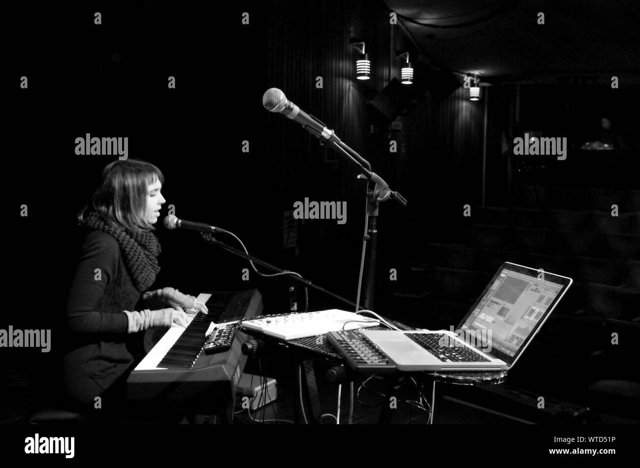 Side View Of Young Woman Singing In Recording Studio Stock Photo - Alamy