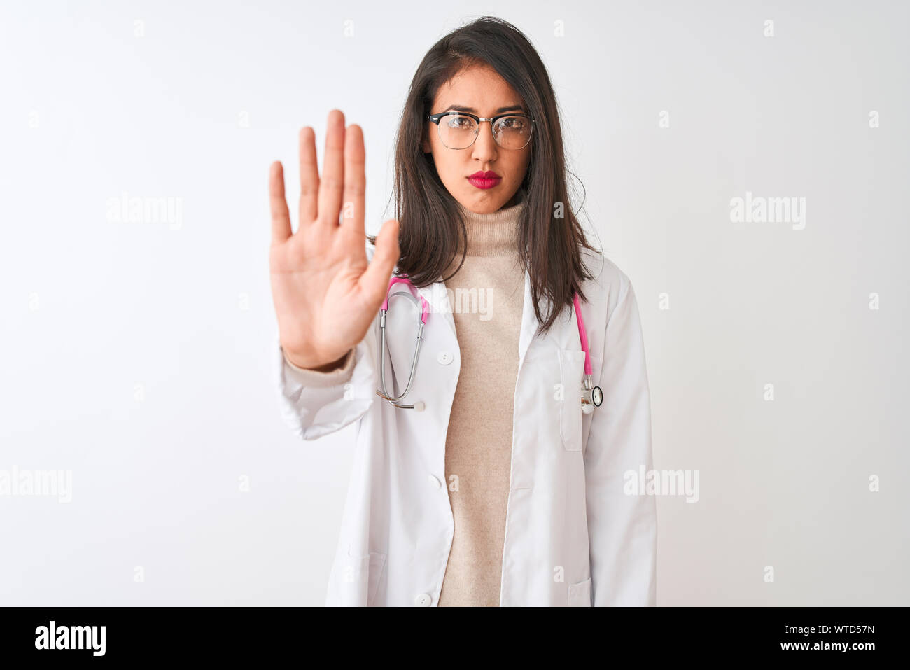 Chinese doctor woman wearing coat and pink stethoscope over isolated ...