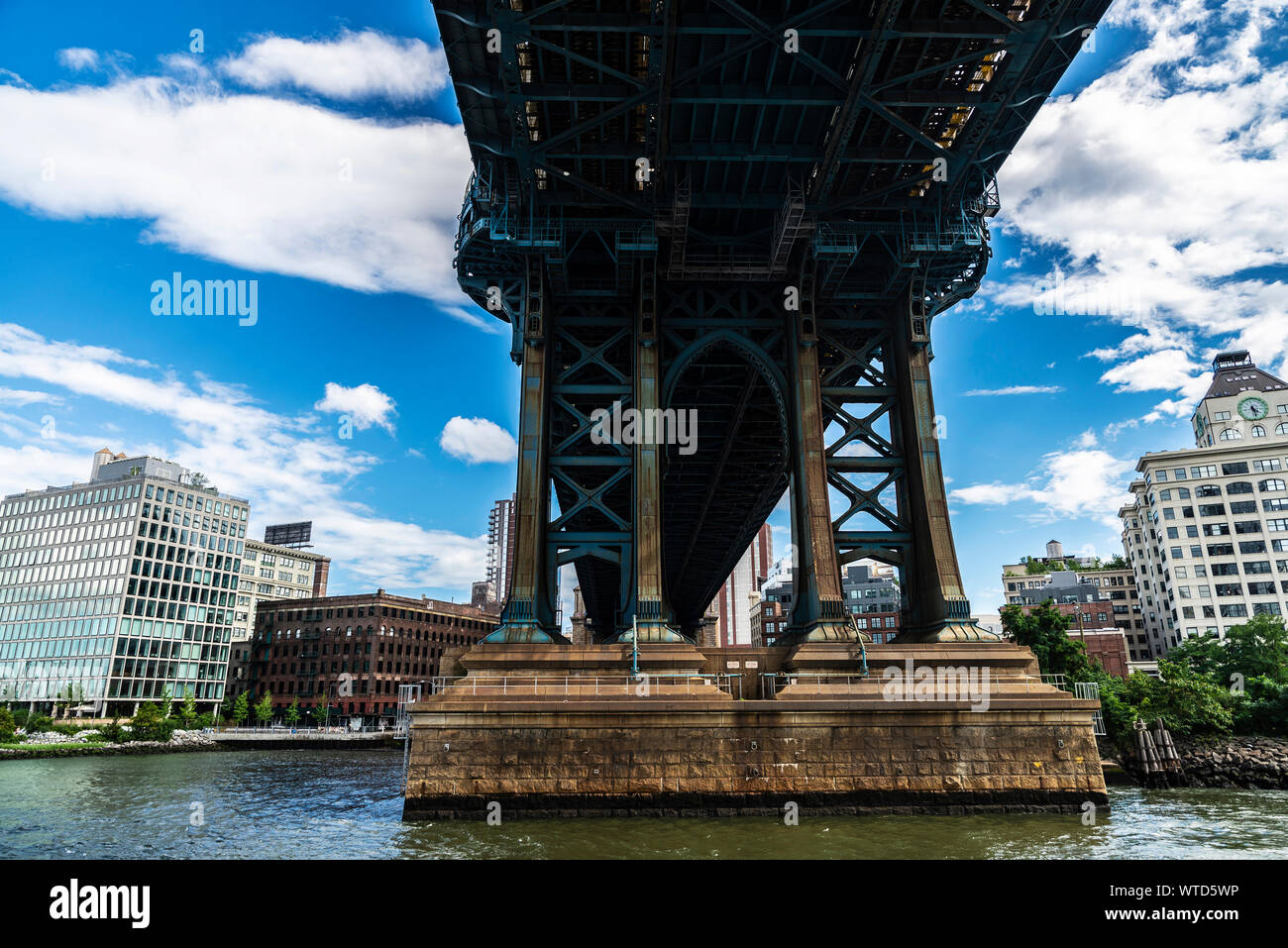 View of the Manhattan Bridge seen from East River in New York City, USA ...