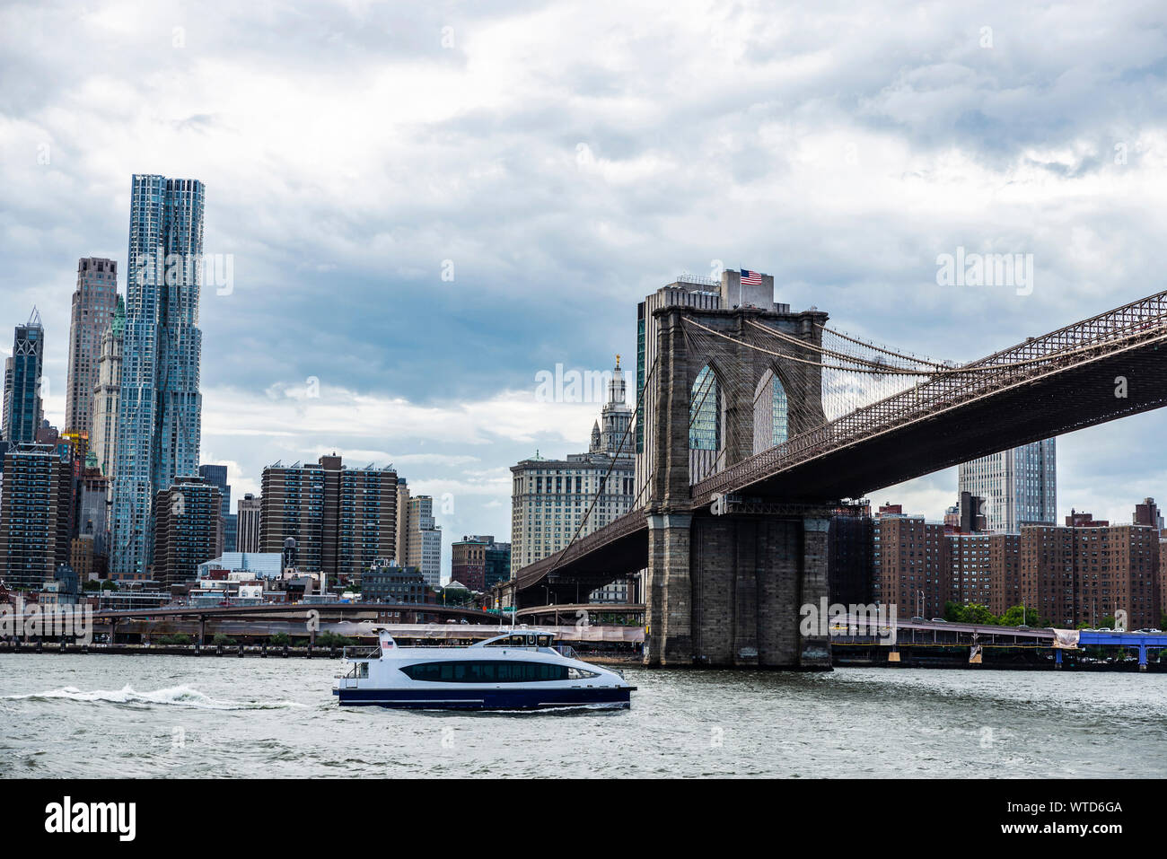 Skyline of the Brooklyn Bridge and modern skyscrapers of Manhattan with ...