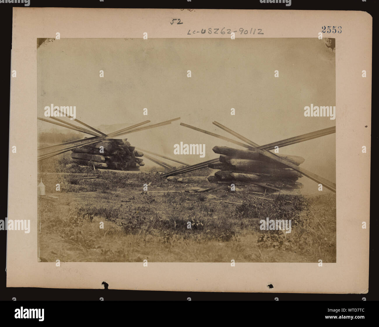 Military railroad operations in northern Virginia: two piles of rails ...