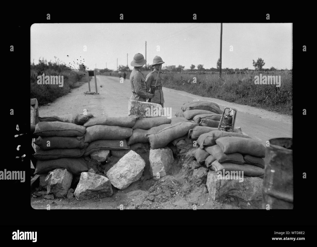 Military road block at junction Ramleh-Lydda Road, later with shade ...