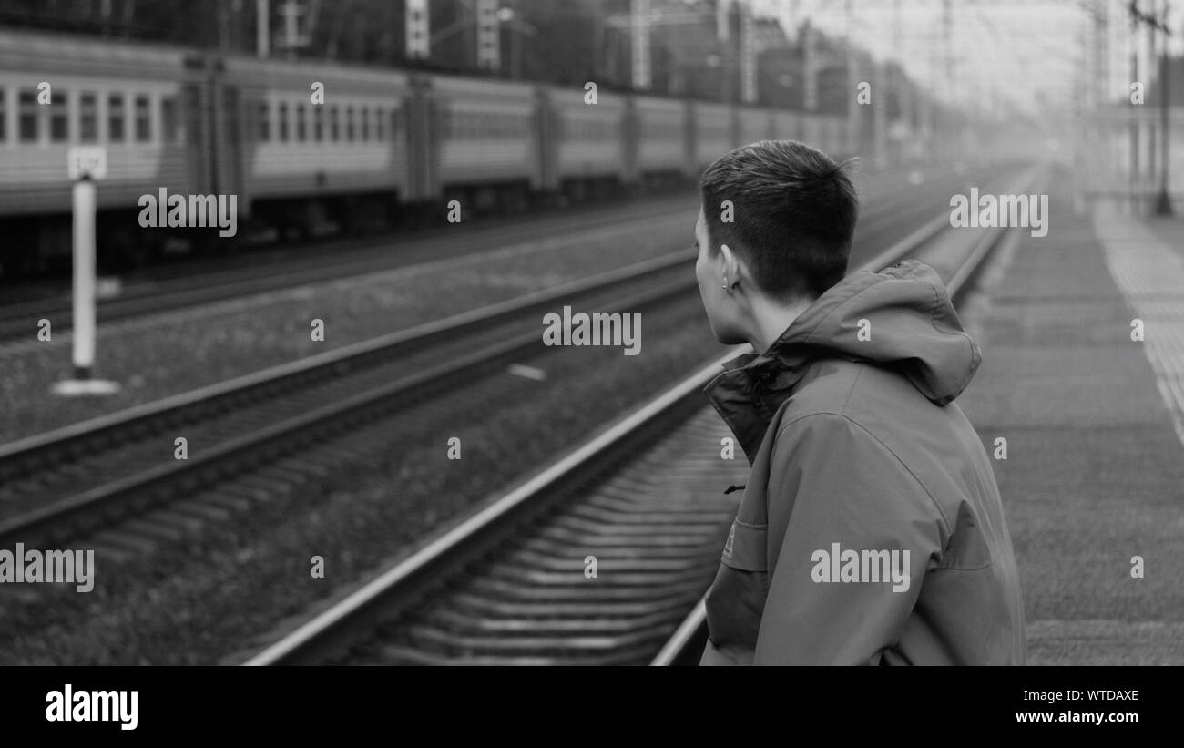 Man on rail platform hi-res stock photography and images - Alamy