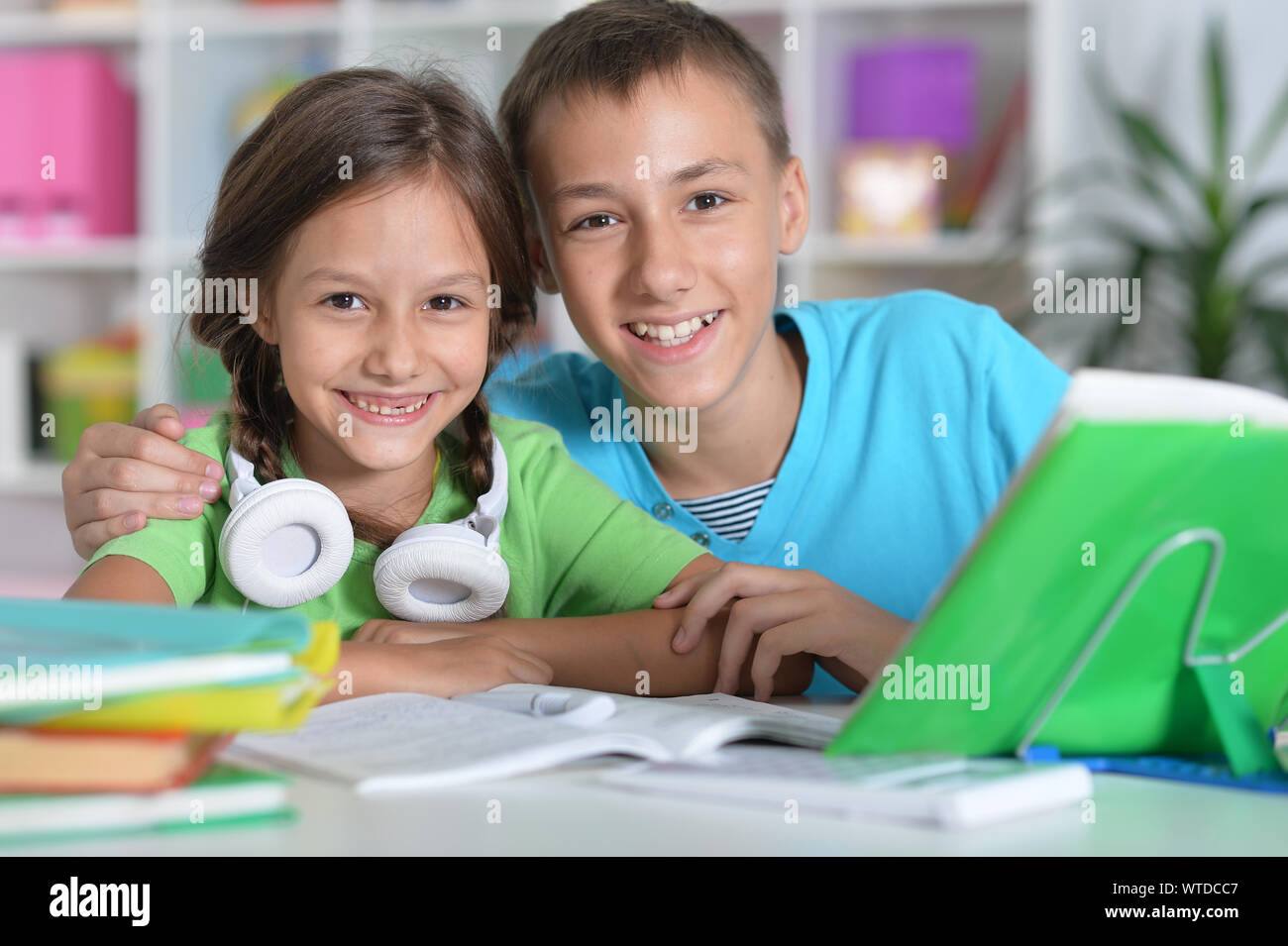 Brother and sister doing homework together in her room Stock Photo - Alamy