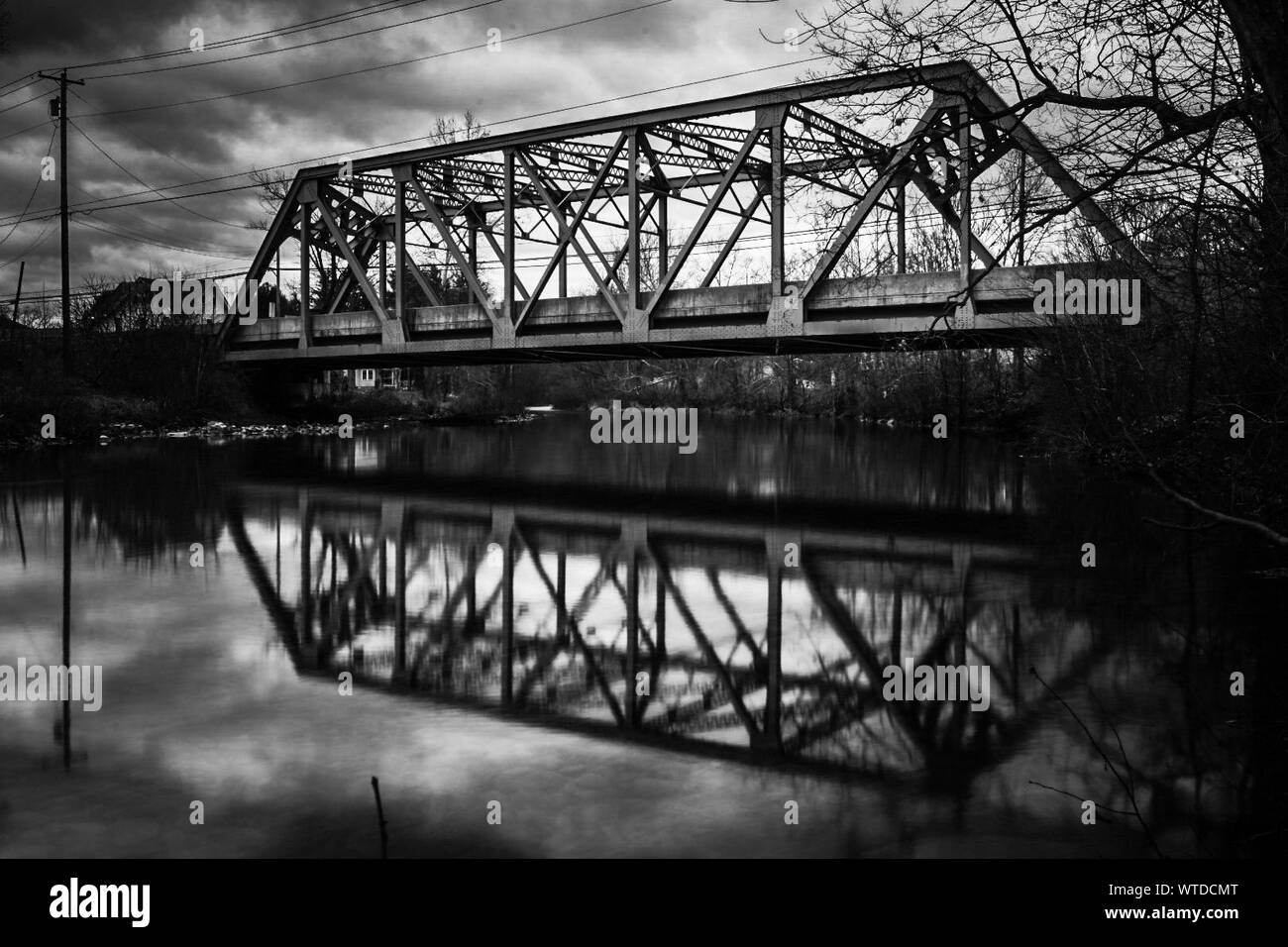 Bridge reflection in the water Black and White Stock Photos & Images ...