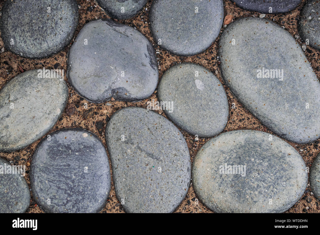 Grey beach round pebbles floor Stock Photo - Alamy