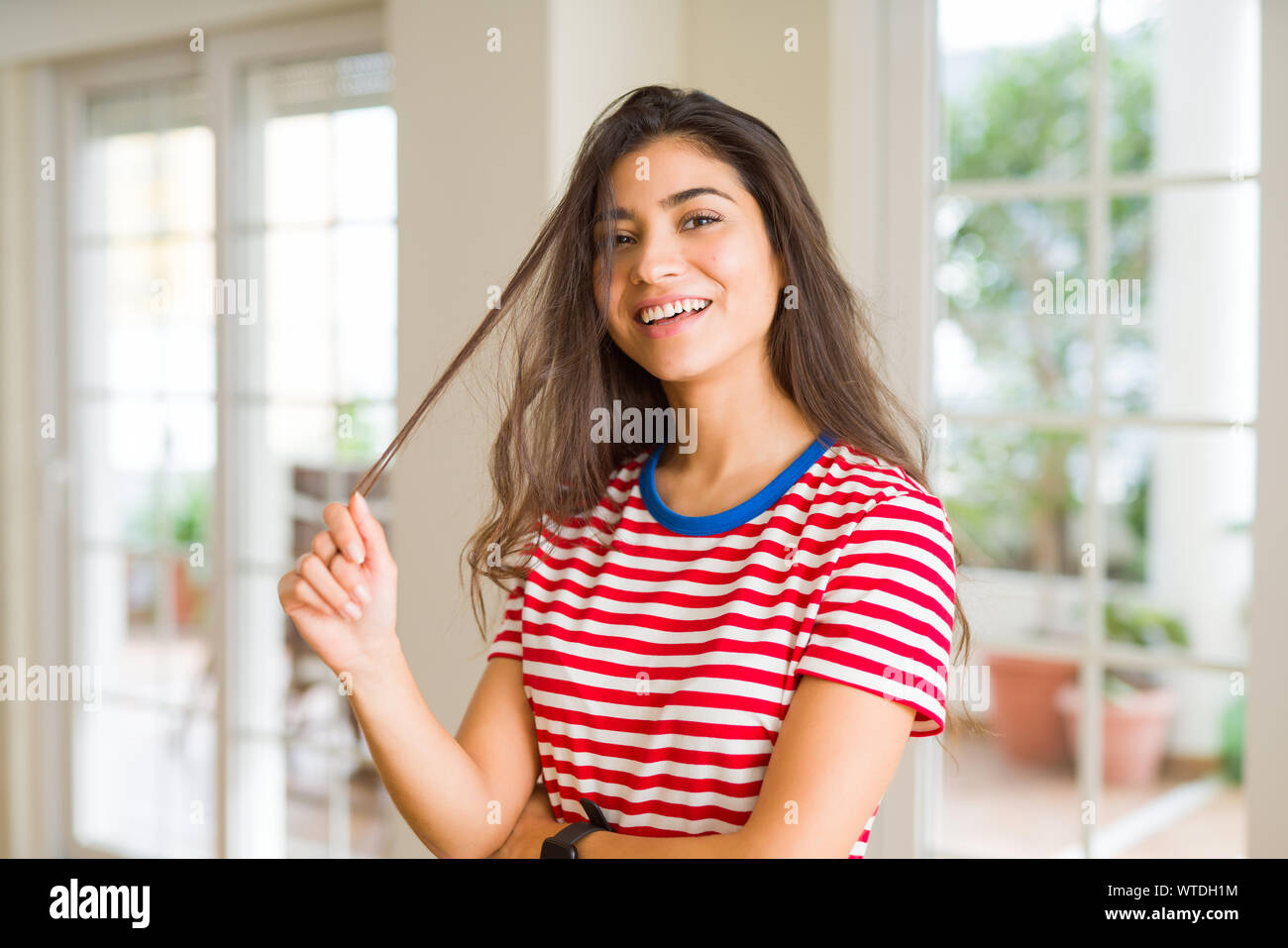 Beautiful brunette woman smiling cheerful, looking happy and positive ...