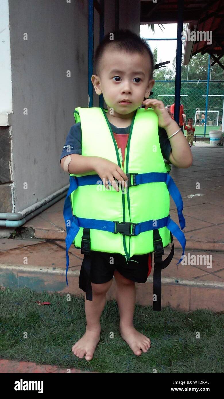 Cute Boy Wearing Life Jacket Stock Photo - Alamy