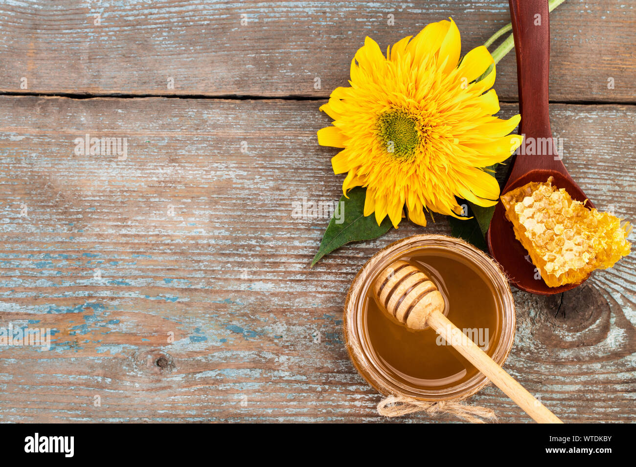 Honey background. Fresh honey in the pot with honeycombs Stock Photo ...