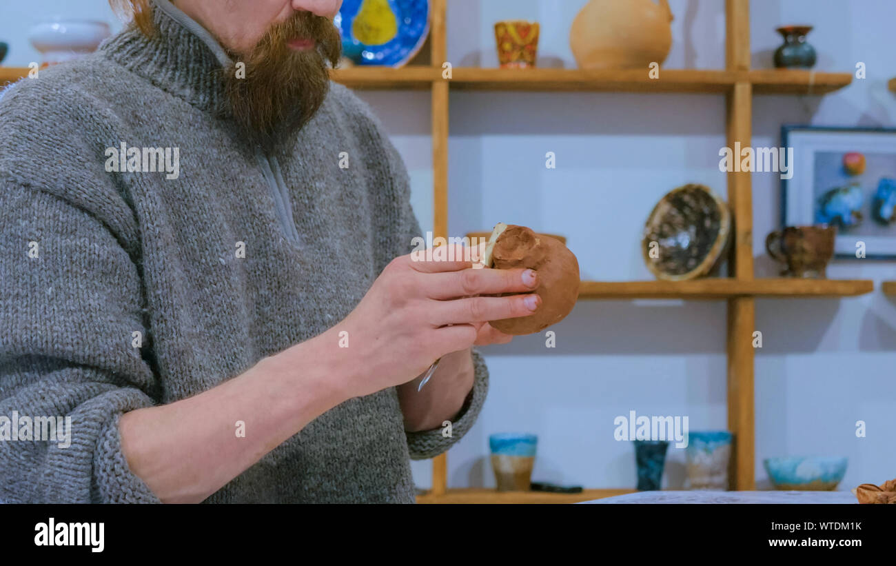 Professional male potter making mug in pottery workshop Stock Photo - Alamy