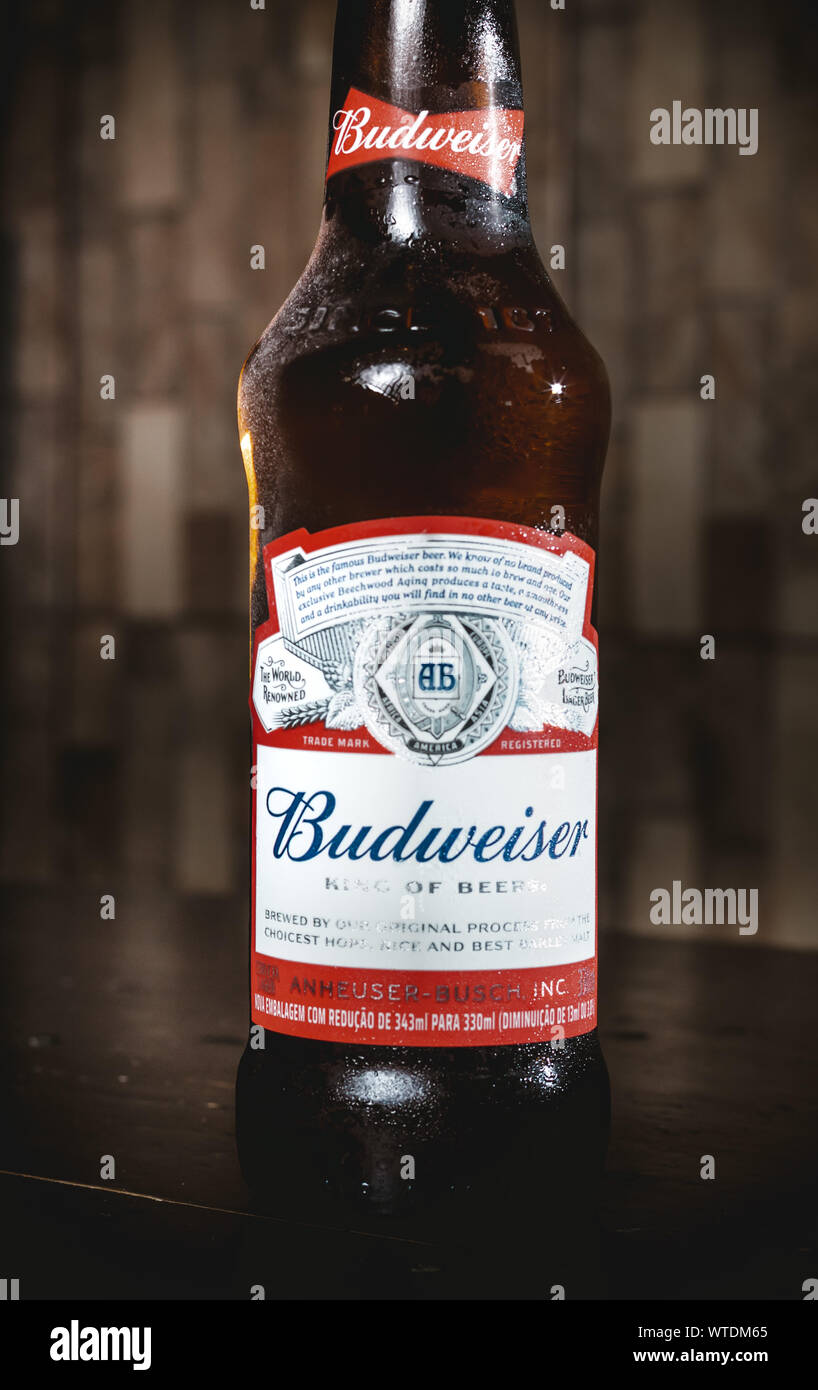 A bottle of Budweiser beer on a wooden table Stock Photo - Alamy