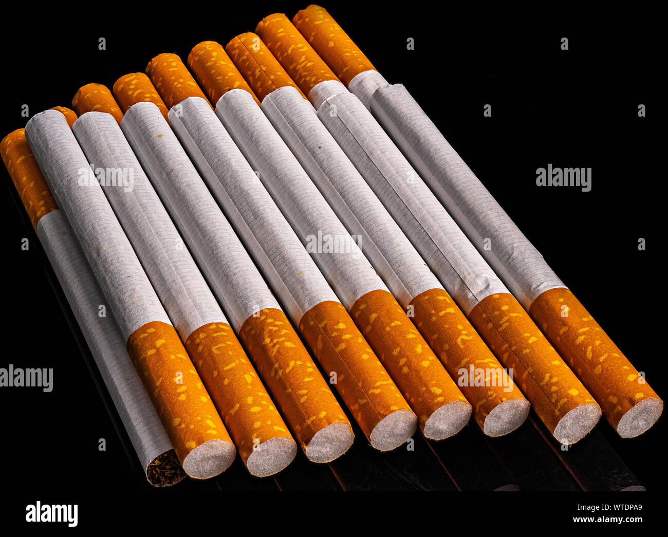 filter cigarettes of detail on black background Stock Photo - Alamy