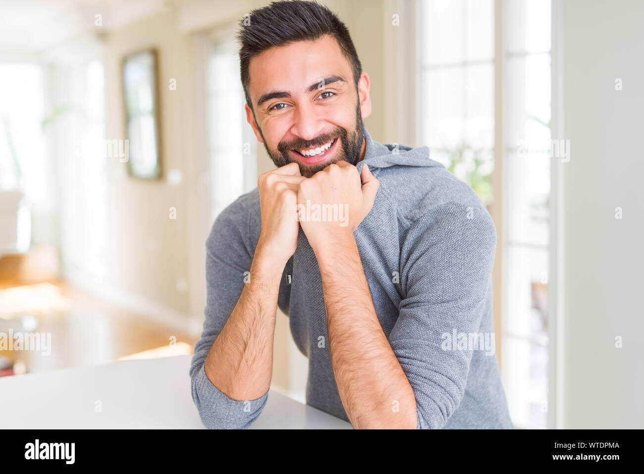 Handsome man smiling cheerful with a big smile on face showing teeth ...