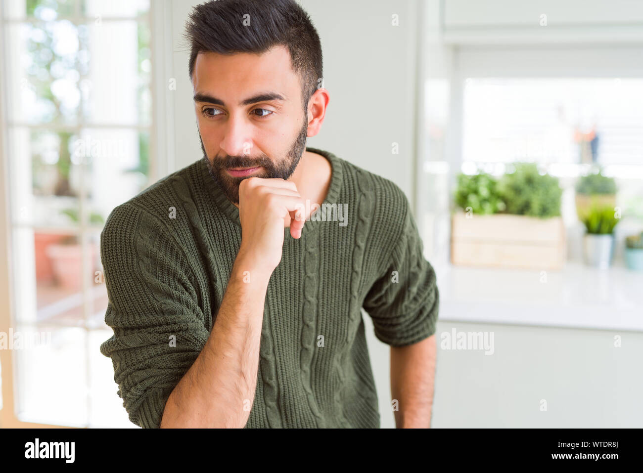 Handsome man thinking confused about doubt, questioning an idea Stock ...