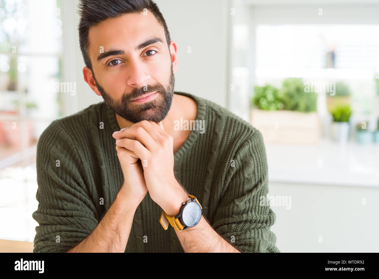 Handsome man looking relaxed and confident Stock Photo - Alamy