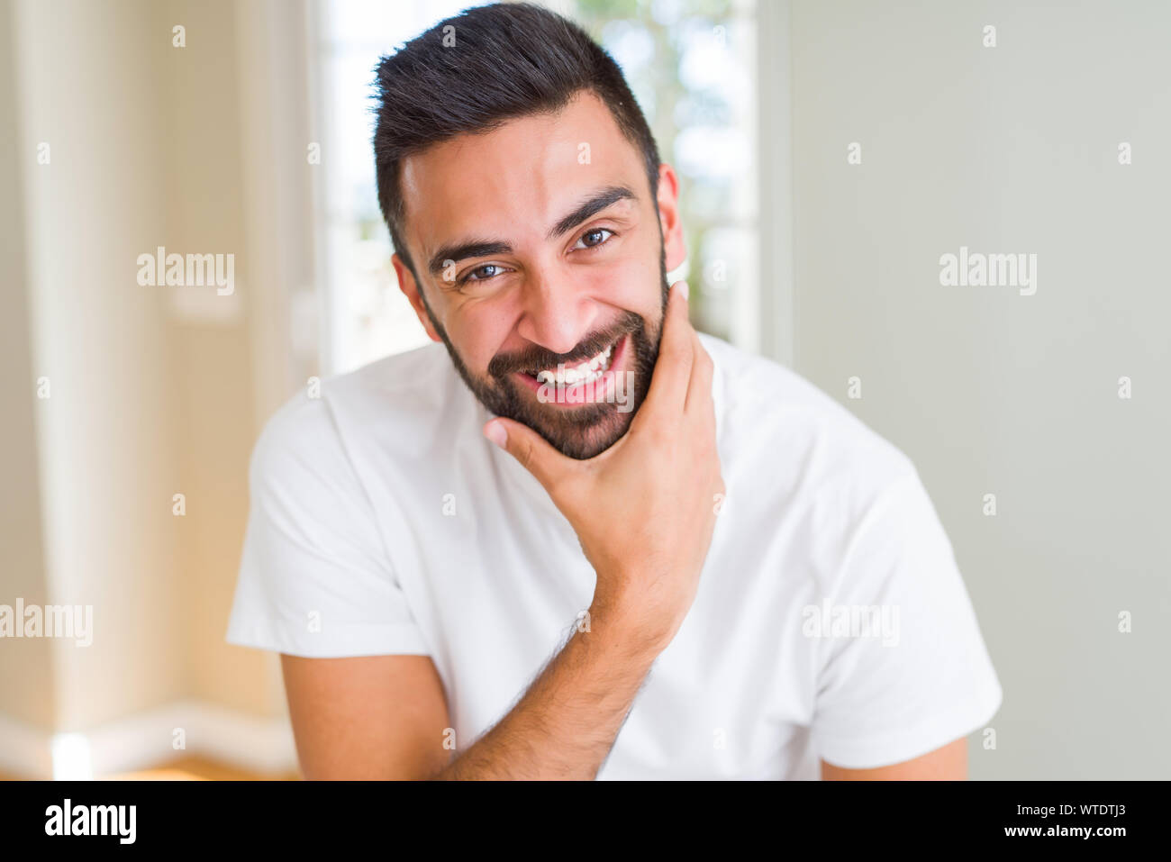 Handsome man smiling cheerful with a big smile on face showing teeth ...
