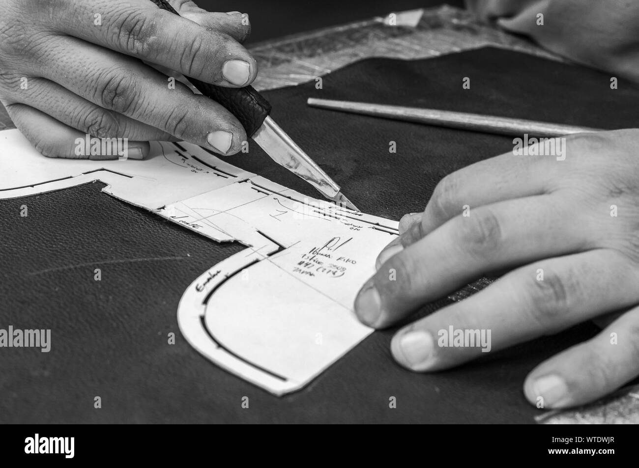 Shoe manufacturing process Black and White Stock Photos & Images - Alamy