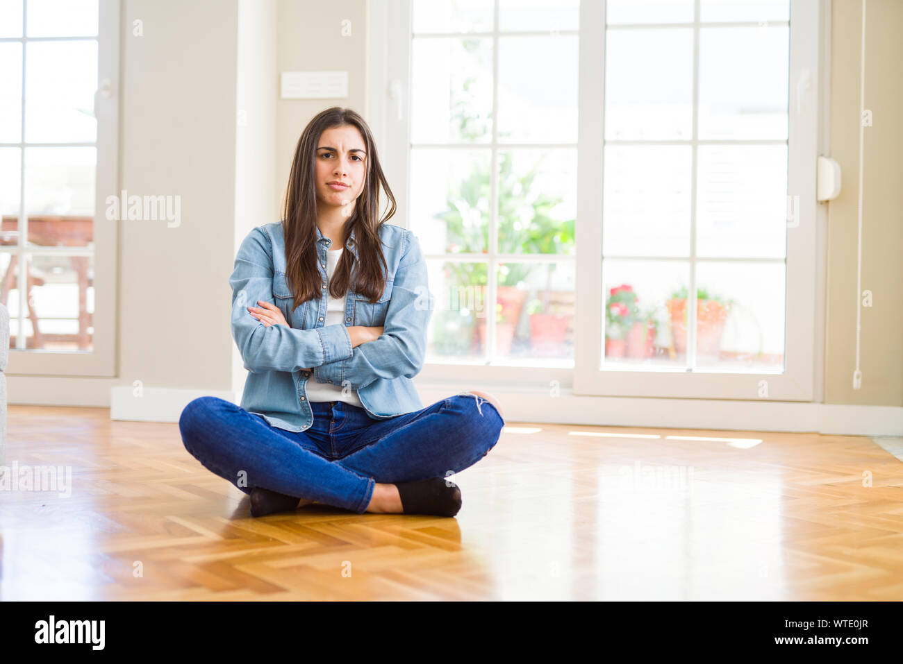 Sitting legs crossed nervous hi-res stock photography and images - Alamy