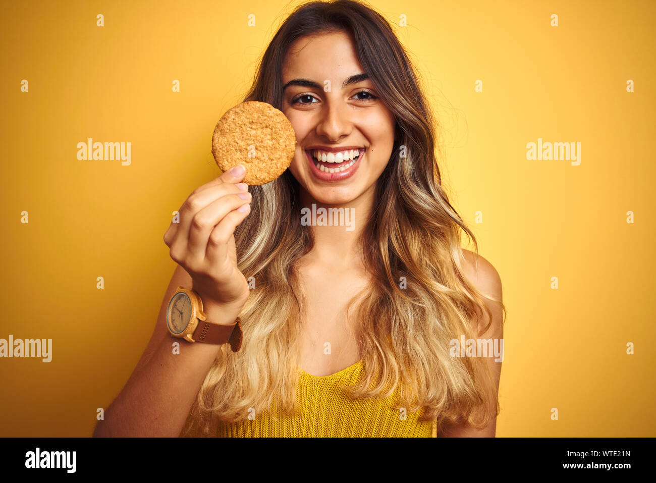 Woman eating a cracker smiling hi-res stock photography and images - Alamy