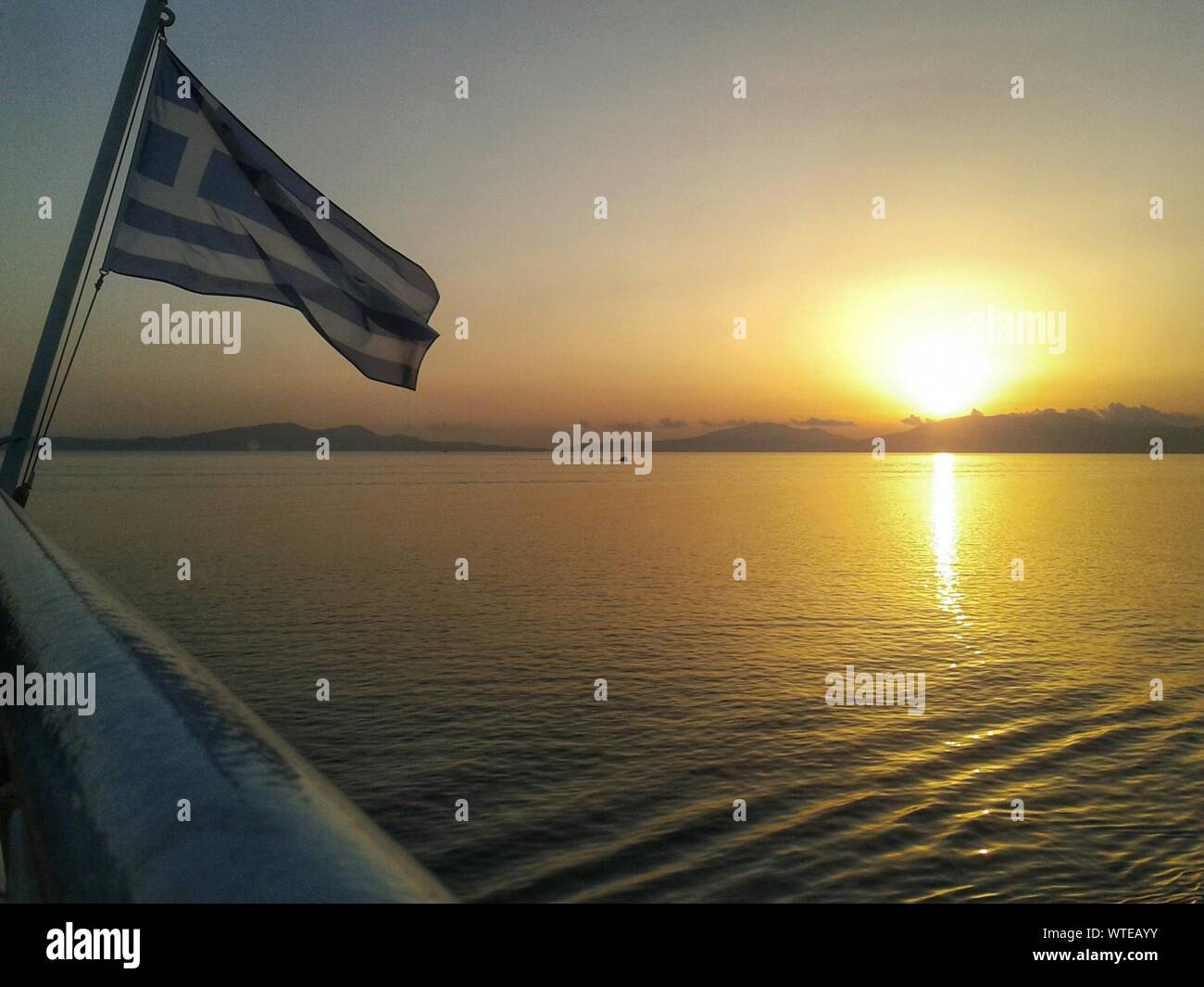 Sunset greek flag hi-res stock photography and images - Alamy