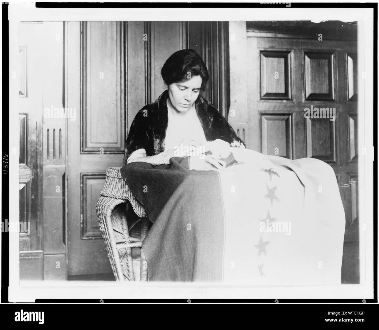 Miss Alice Pavl is shown sewing the thirty-sixth star on the suffrage ...