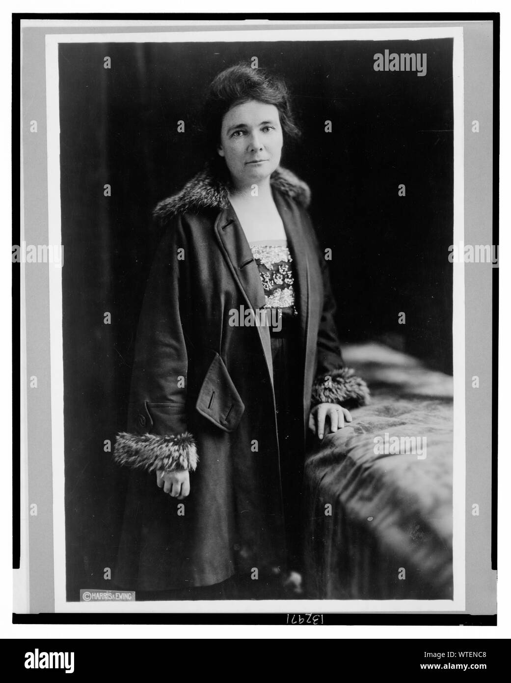 Miss Anne Martin, three-quarter length portrait, standing, facing front ...